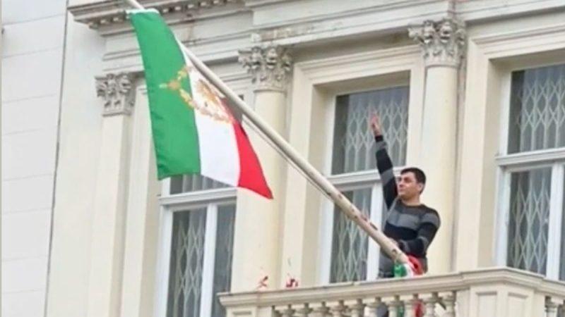 Protester scales Iranian Embassy in London, tears down regime flag ...